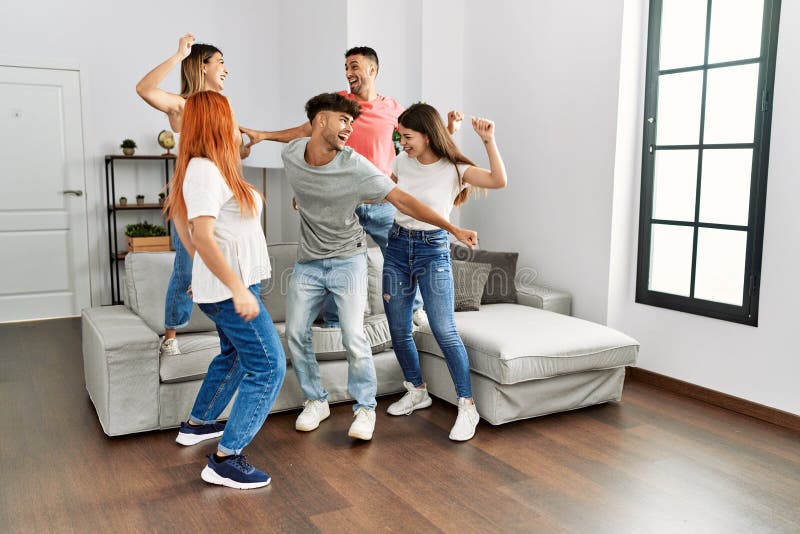 Group of Young Friends Smiling Happy and Dancing at Home Stock Photo ...
