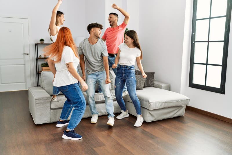 Group of Young Friends Smiling Happy and Dancing at Home Stock Photo ...