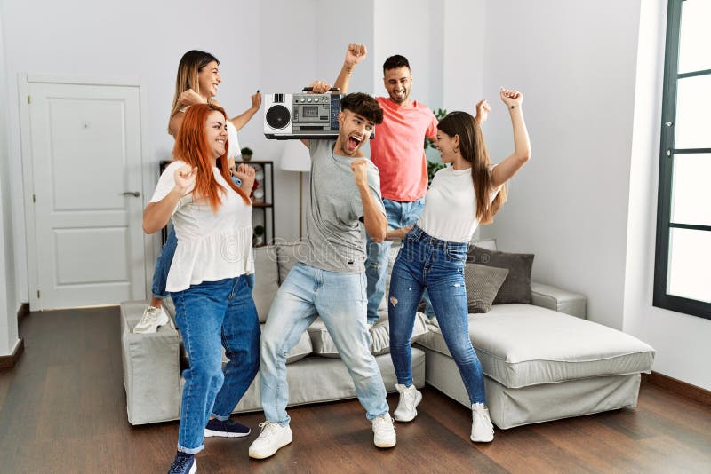 Group of Young Friends Smiling Happy and Dancing at Home Stock Photo ...