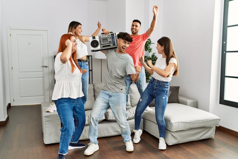 Group of Young Friends Smiling Happy and Dancing at Home Stock Photo ...