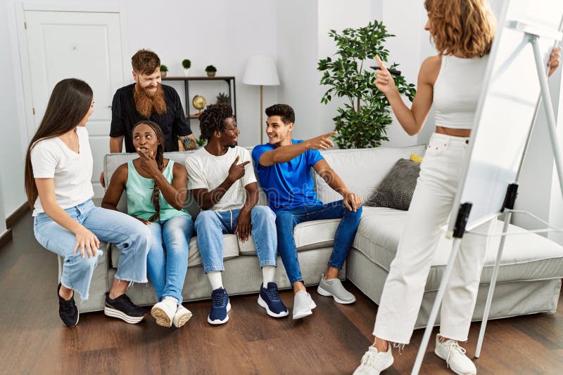 Group of Young Friends Smiling Happy Playing Drawing Game at Home Stock ...