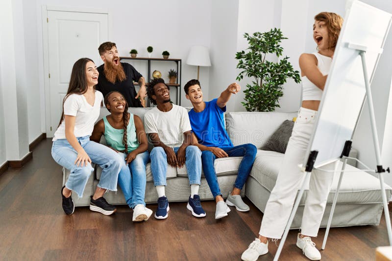 Group of Young Friends Smiling Happy Playing Drawing Game at Home Stock ...