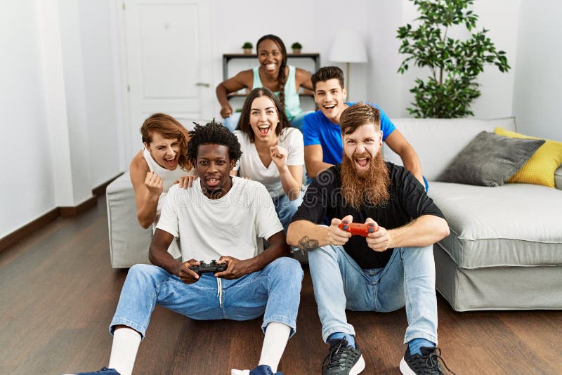 Group of Young Friends Smiling Happy Playing Video Game at Home Stock ...