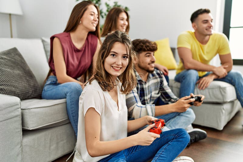 Group of Young Friends Smiling Happy Playing Video Game at Home Stock ...
