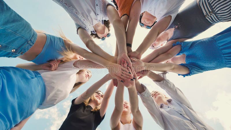 Group of Young Friends are Standing in a Circle Joining Hands Together ...