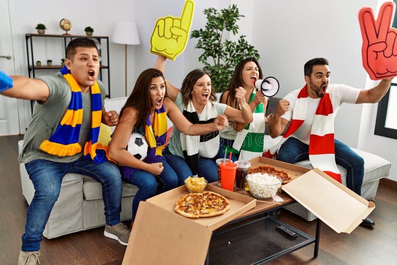 Group of Young Friends Watching and Supporting Soccer Match at Home ...