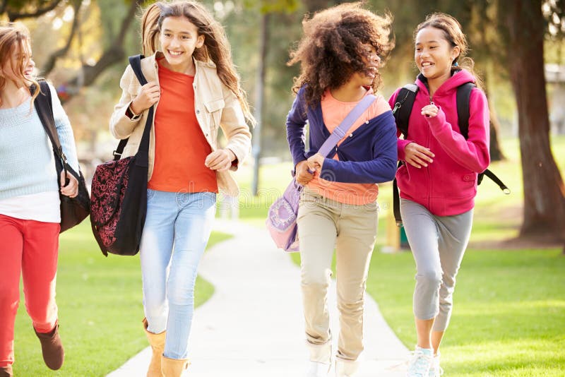 Group of Young Girls Running Towards Camera in Park Stock Image - Image ...