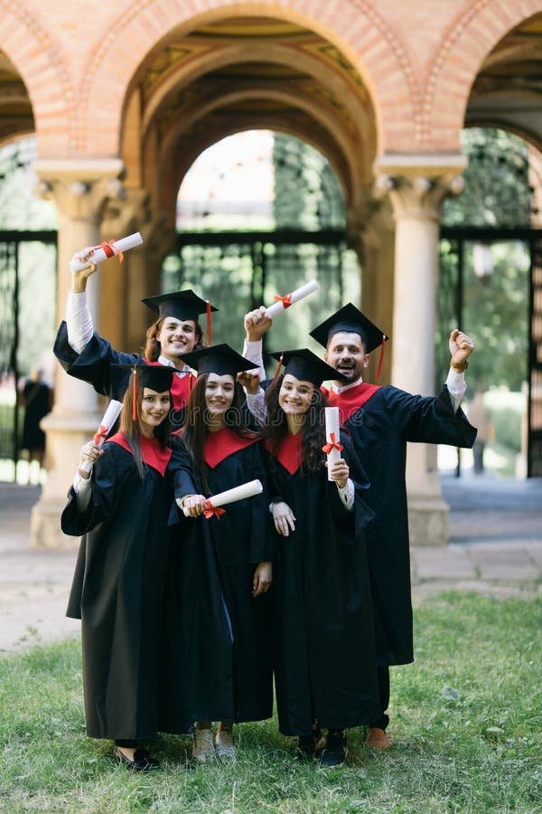 Group of Young Graduate Students Holding Their Diploma after Graduation ...