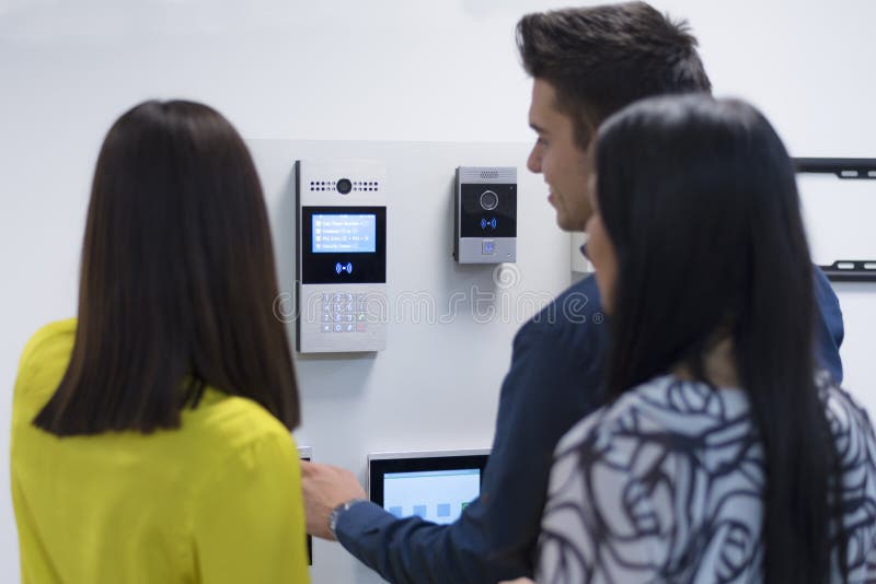 Group of Young Handsome Engineers Working on Electronics Components ...