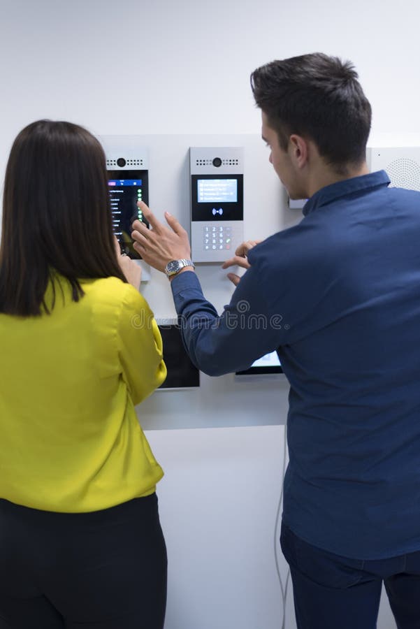 Group of Young Handsome Engineers Working on Electronics Components ...