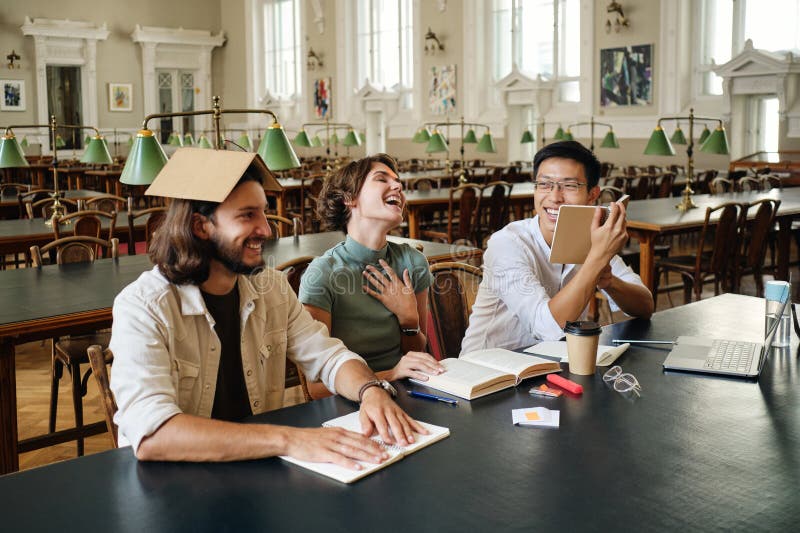 Group of Young Happy Multinational Students Joyfully Fooling Around ...