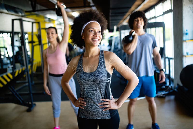 Group of Young People Doing Exercises in Gym Stock Image - Image of ...