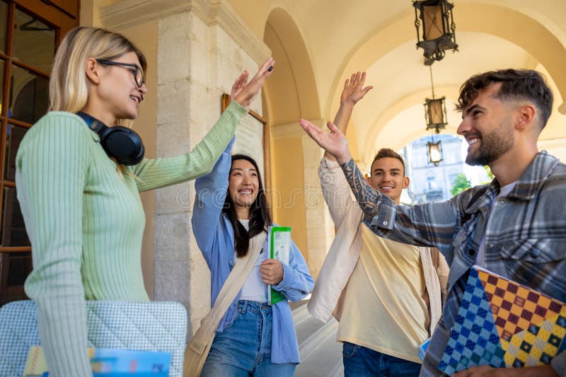 Young Happy Students Having Fun Together Outside University Giving High ...