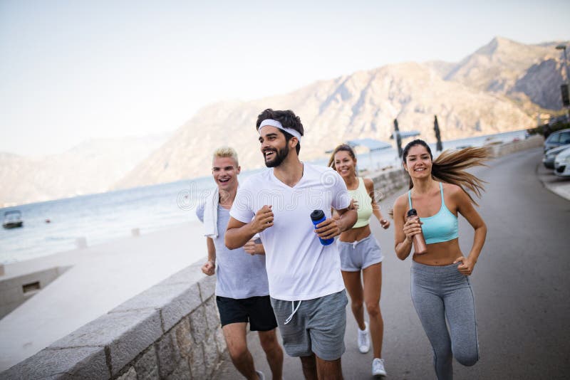 Group of Young People Jogging and Running Outdoors in Nature Stock ...