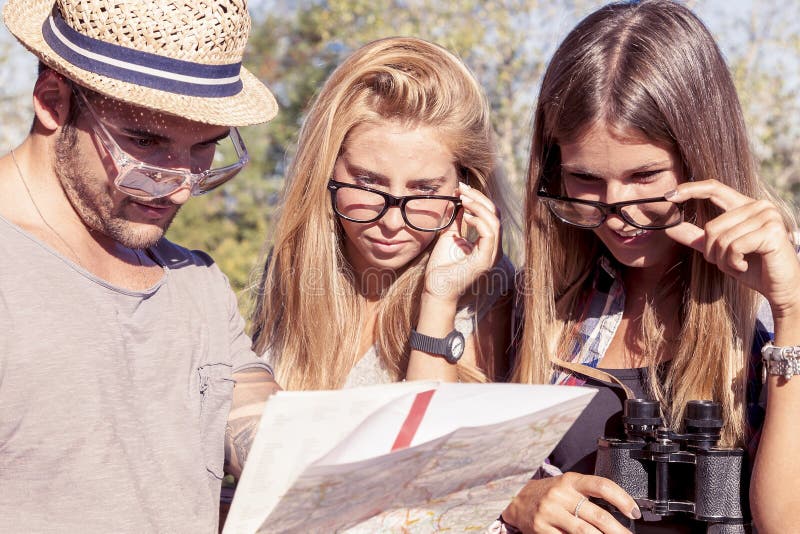 Group of Young Hikers Search on the Map Stock Image - Image of hiking ...