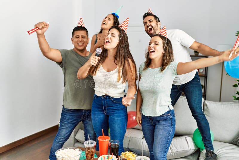 Group of Young Hispanic Friends Having Birthday Party Singing Song ...