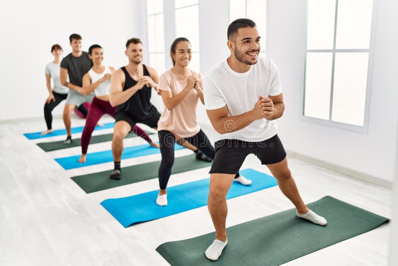 Group of Young Hispanic People Smiling Happy Training Legs Exercise at ...