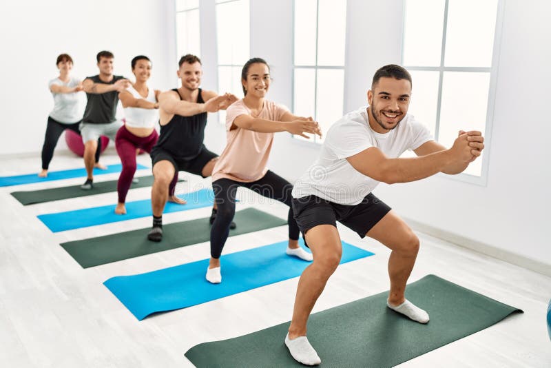 Group of Young Hispanic People Smiling Happy Training Legs Exercise at ...