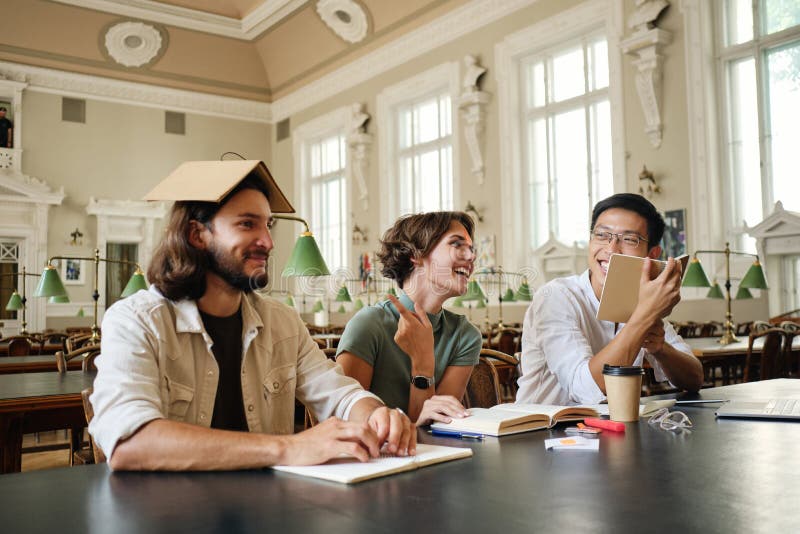 Group of Young Joyful Multinational Students Happily Fooling Around ...