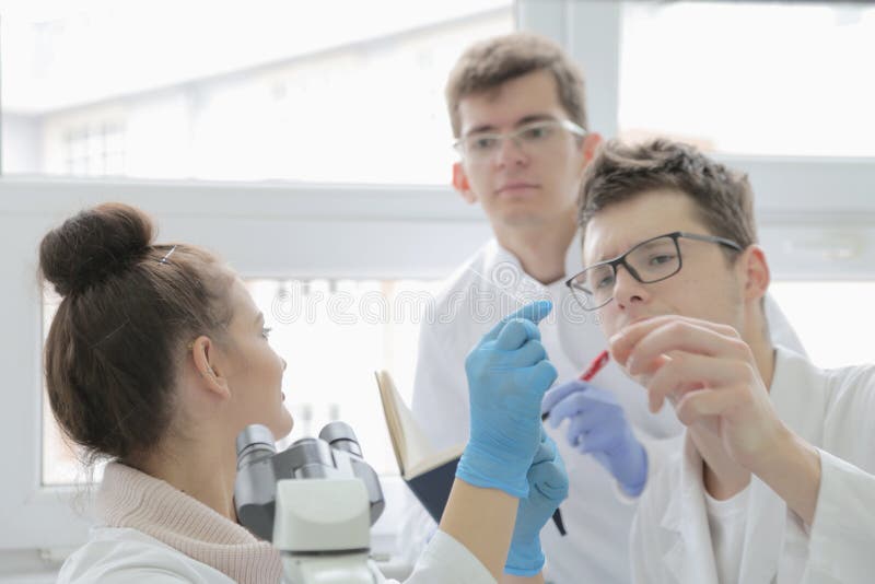 Group of Young Laboratory Scientists Working at Lab with Test Tu Stock ...