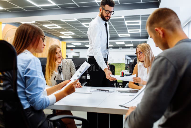 Group of Young Leaders Sitting at Their Desk Discussing Planning the ...