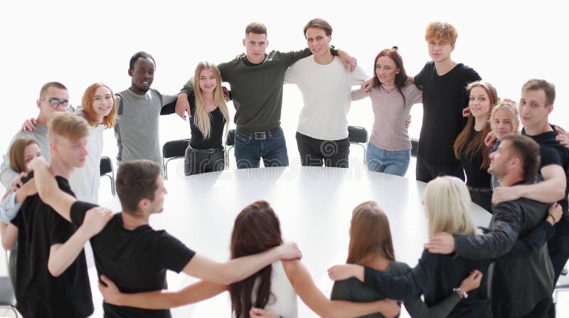Group of Young Like-minded People Standing Around a Table Stock Photo ...