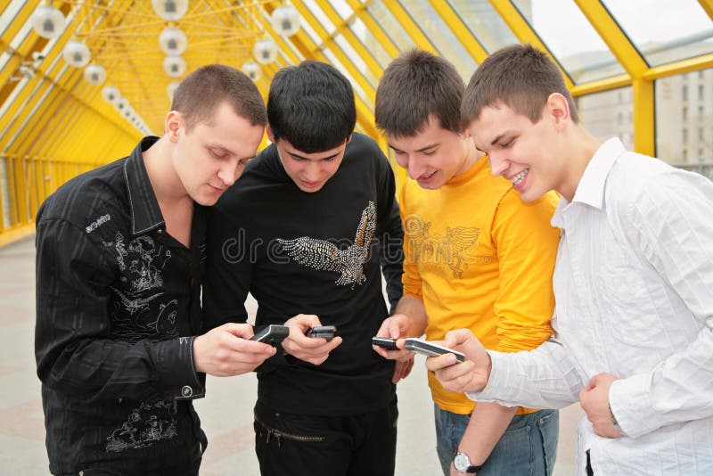Group of Young Men with Cell Phones Stock Photo - Image of brunet ...