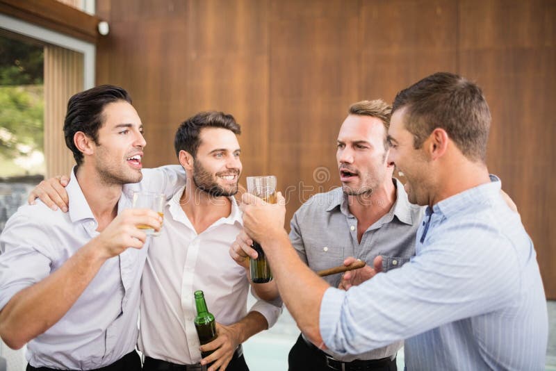 Group of Young Men Having Drinks Stock Photo - Image of glass, four ...