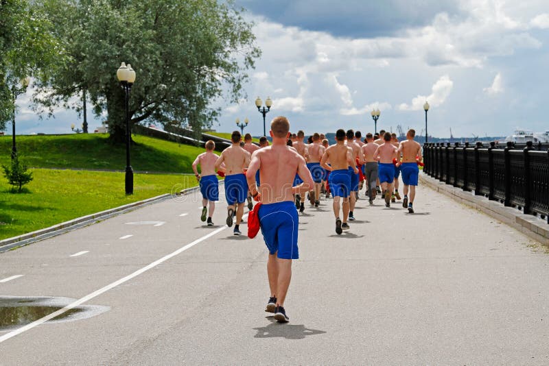Group of Young Men Running Along the Waterfront Editorial Stock Photo ...