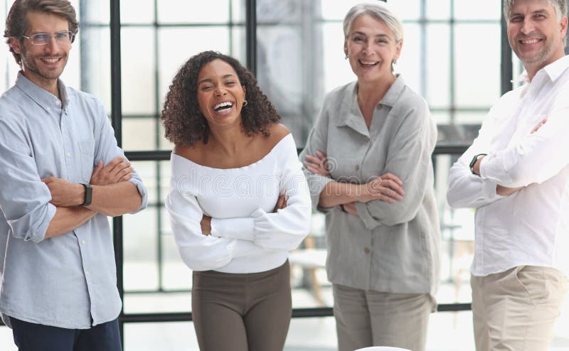 A Group of Young Modern People in Smart Casual Clothes, Studying while ...