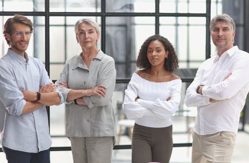 A Group of Young Modern People in Smart Casual Clothes, Studying while ...