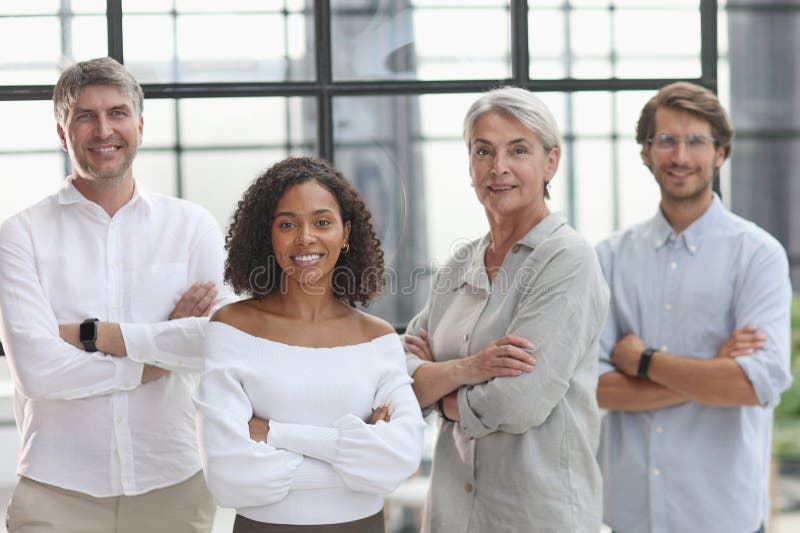 A Group of Young Modern People in Smart Casual Clothes, Studying while ...