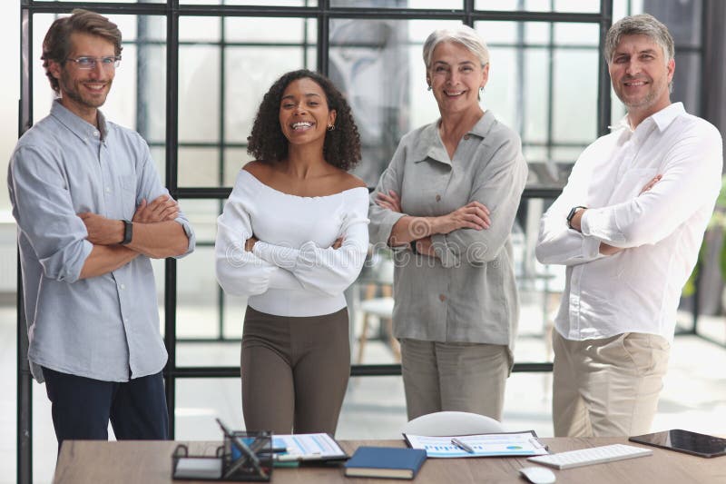 A Group of Young Modern People in Smart Casual Clothes, Studying while ...