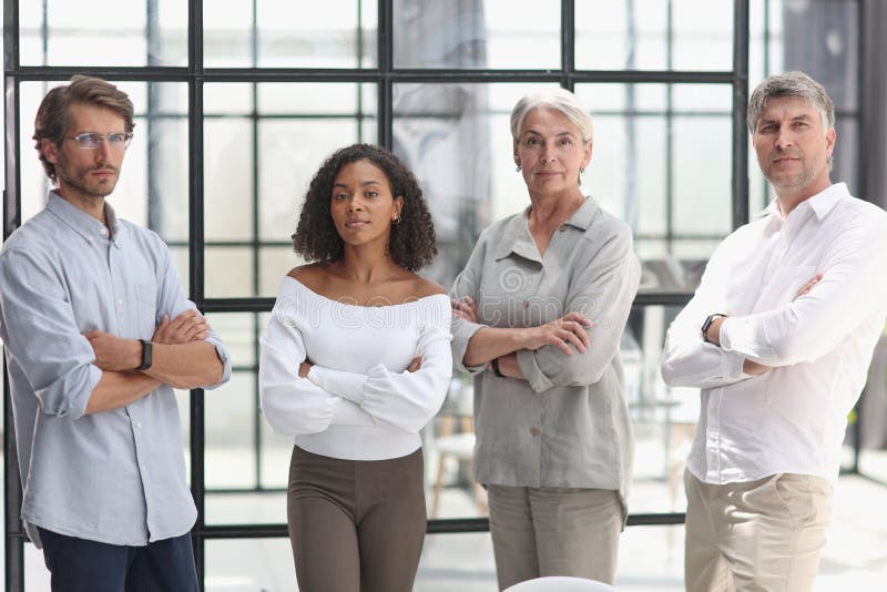 A Group of Young Modern People in Smart Casual Clothes, Studying while ...