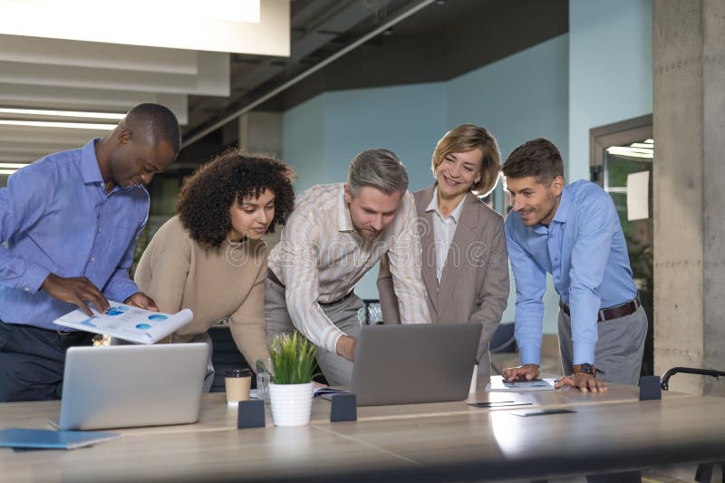 Group of Young Modern People Using Modern Technologies while Working in ...