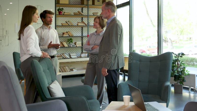 Group of Young Modern People Using Modern Technologies while Working in ...