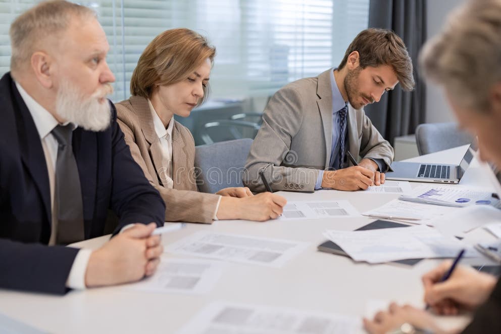 Group of Young Modern People Using Modern Technologies while Working in ...