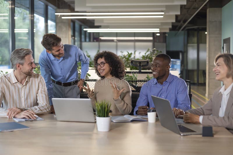 Group of Young Modern People Using Modern Technologies while Working in ...