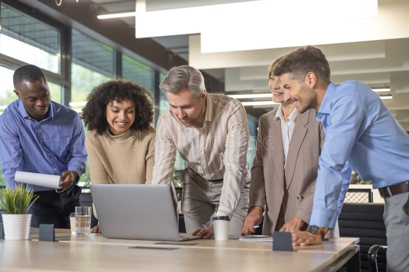 Group of Young Modern People Using Modern Technologies while Working in ...