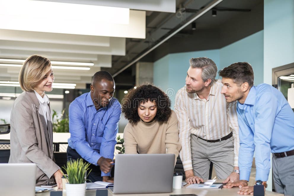 Group of Young Modern People Using Modern Technologies while Working in ...