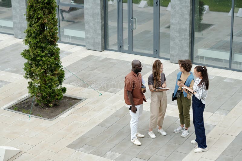 Group of Young Multicultural Employees in Casualwear Discussing Working ...