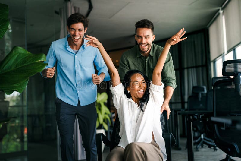 Group of Young Multiracial Diverse Office Workers is Caught in a Moment ...