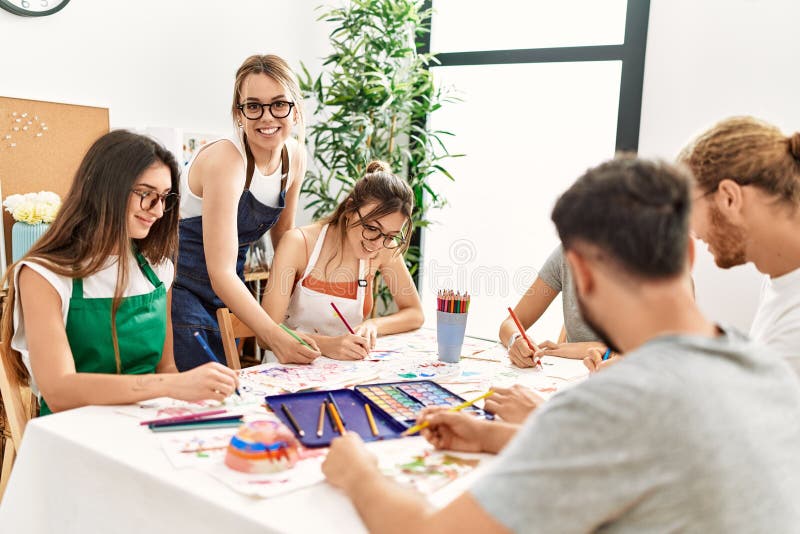 Group of Young Paint Students Smiling Happy and Drawing Sitting on the ...