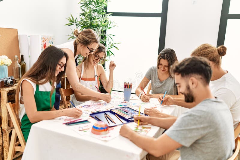Group of Young Paint Students Smiling Happy and Drawing Sitting on the ...