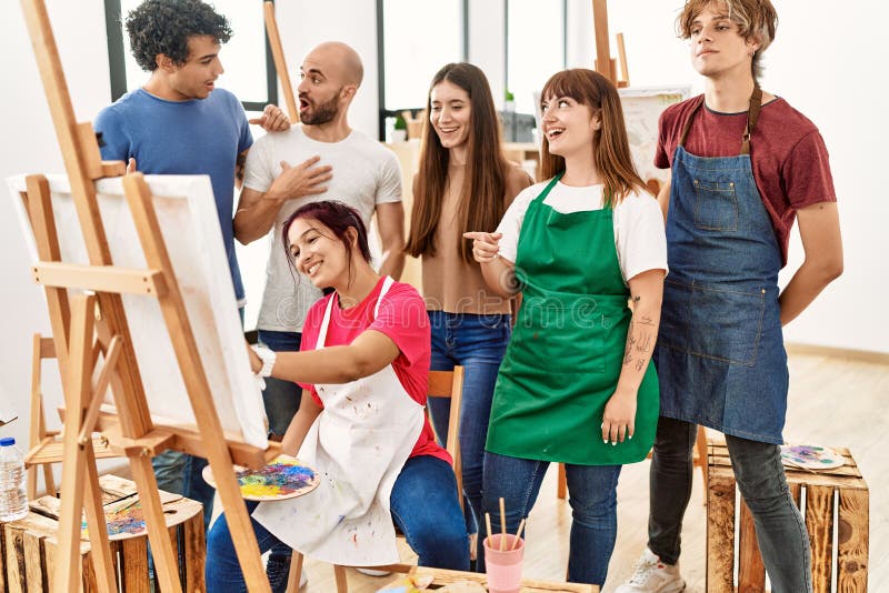 Group of Young Paint Students Smiling Happy and Looking Draw of Partner ...