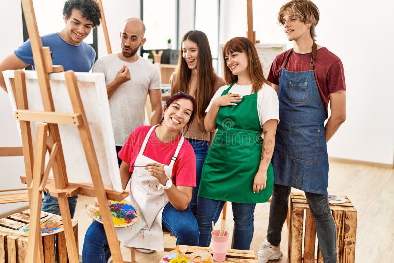 Group of Young Paint Students Smiling Happy and Looking Draw of Partner ...