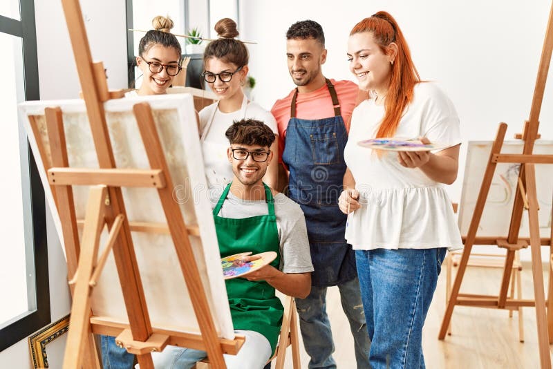 Group of Young Paint Students Smiling Happy and Looking Draw of Partner ...