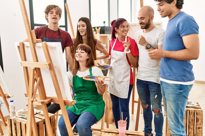 Group of Young Paint Students Smiling Happy and Looking Draw of Partner ...