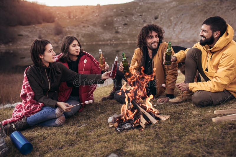 Group of Young People Around Camp Fire Stock Photo - Image of mountain ...