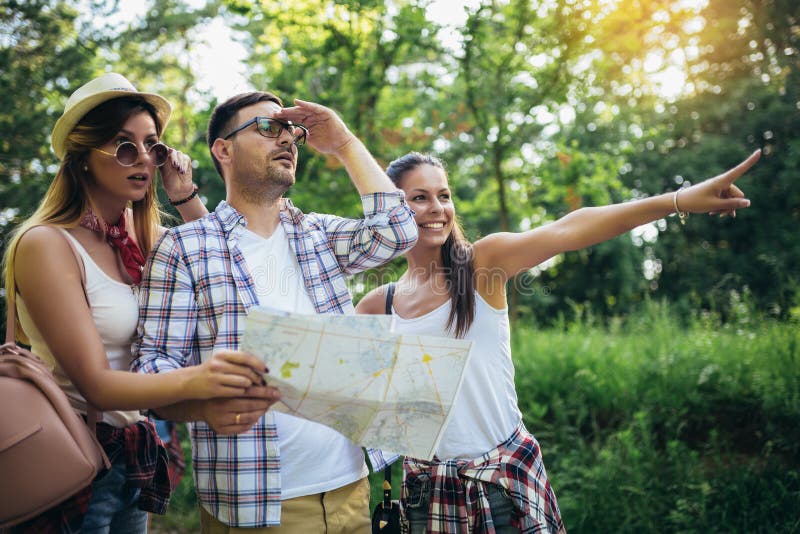 Young People with Backpacks Walking Together and Looking Happy Stock ...